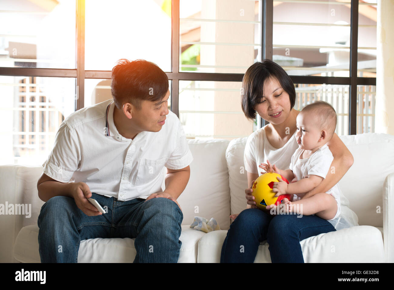 asian parent playing with their baby Stock Photo - Alamy