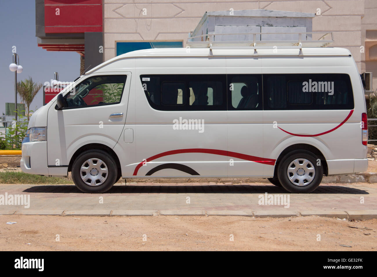 White commercial passenger mini bus waiting for tourists Stock Photo ...