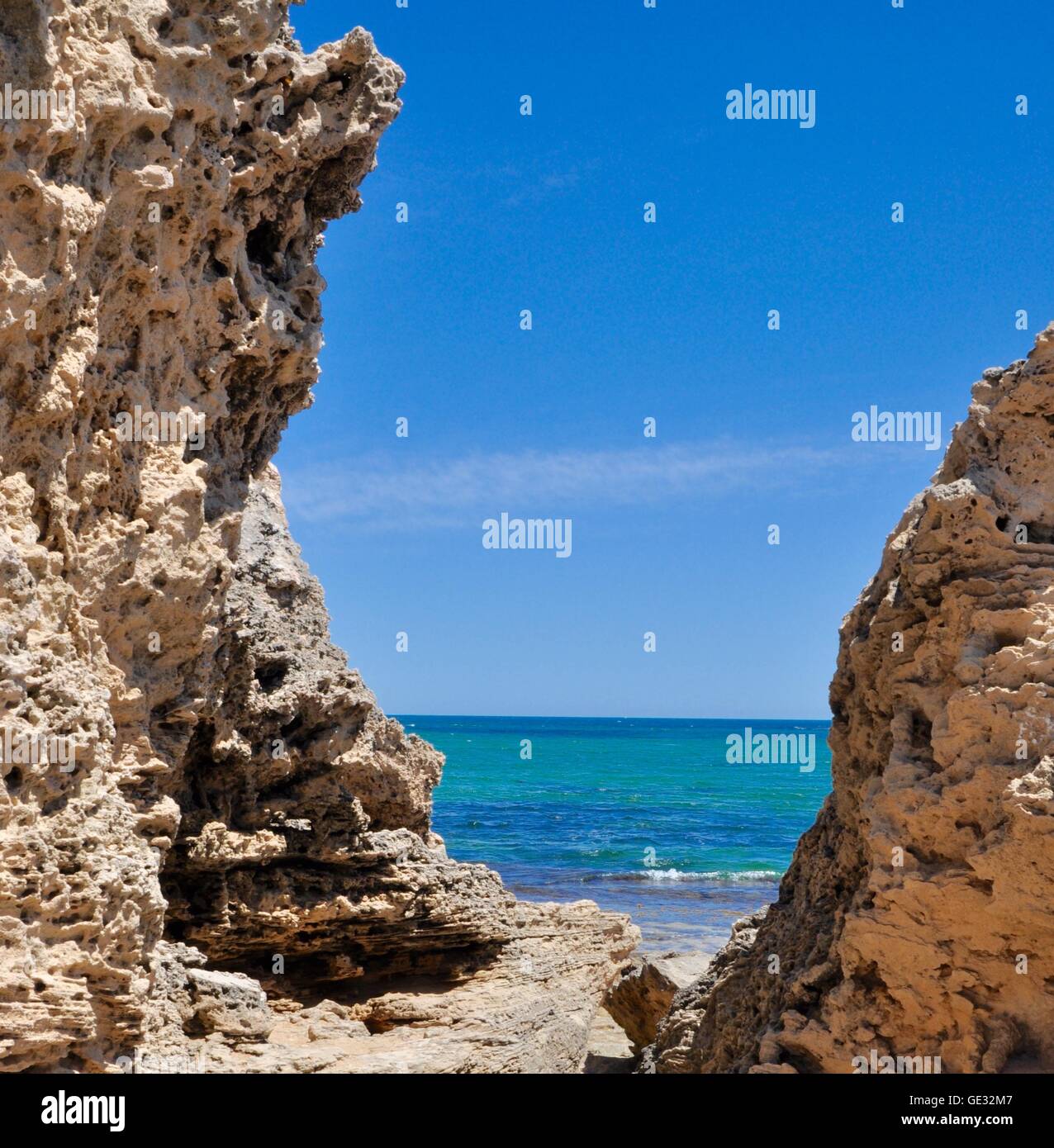 View through coastal limestone at Cape Peron with turquoise-green ...