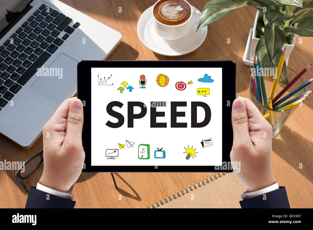 SPEED on tablet on screen, table and coffee Business Stock Photo - Alamy
