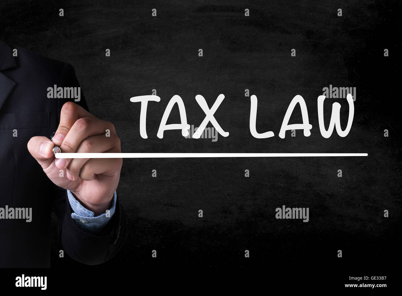 Tax Law Business Concept and Businessman drawing Page on blackboard ...