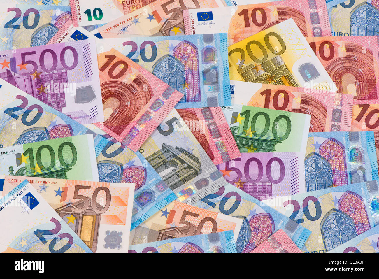 Many Euro banknotes in detail on table Stock Photo - Alamy