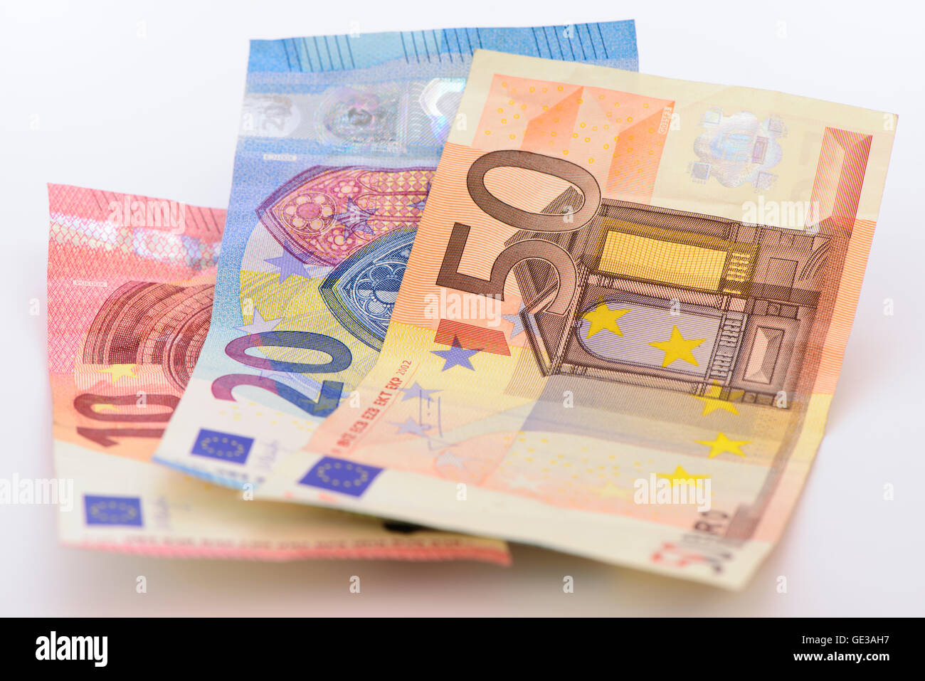 three Euro banknotes as group laying on table Stock Photo - Alamy