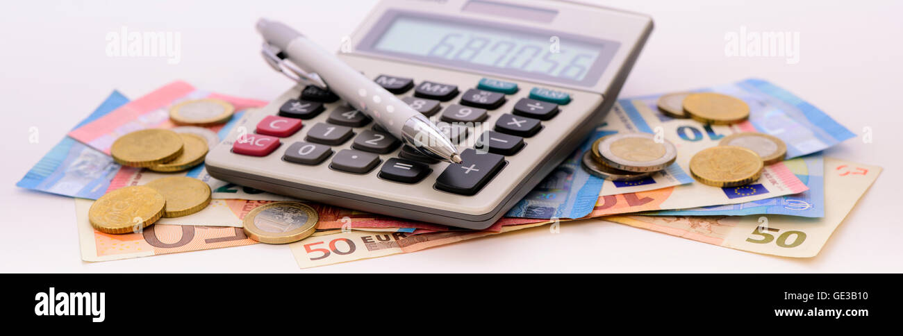 Many Euro banknotes and calculator laying on table Stock Photo - Alamy
