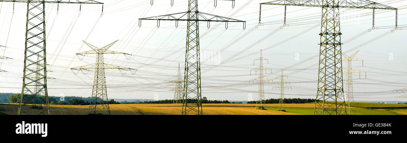 panorama view to many electric power poles in Germany Stock Photo - Alamy