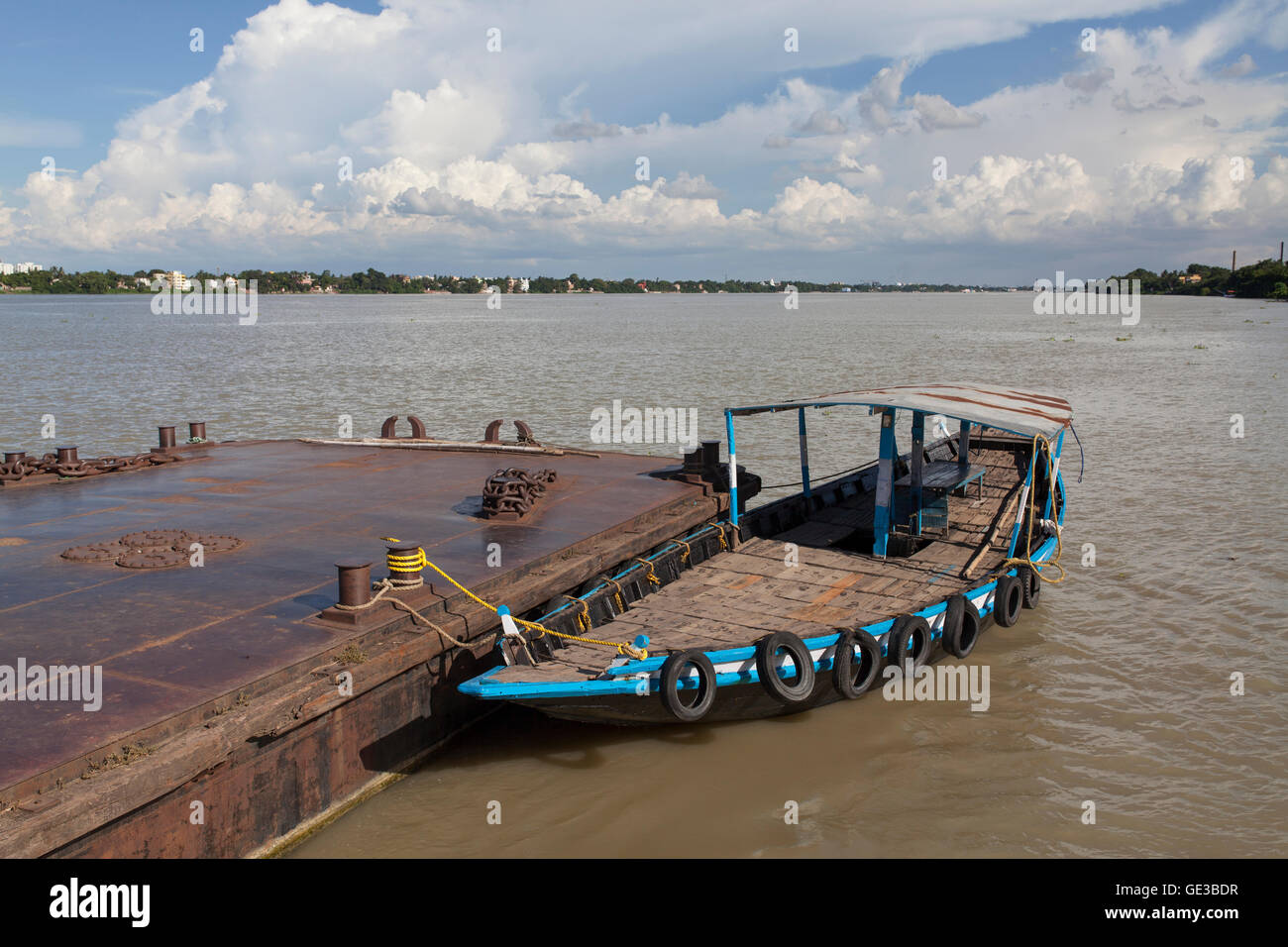 A boat fixed with rope in a ferryghat Stock Photo - Alamy