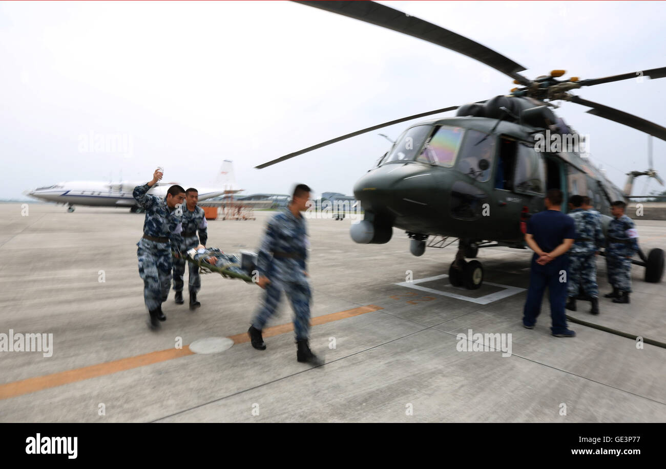Chengdu, China. 22nd July, 2016. Soldiers carry an "injured" person to ...