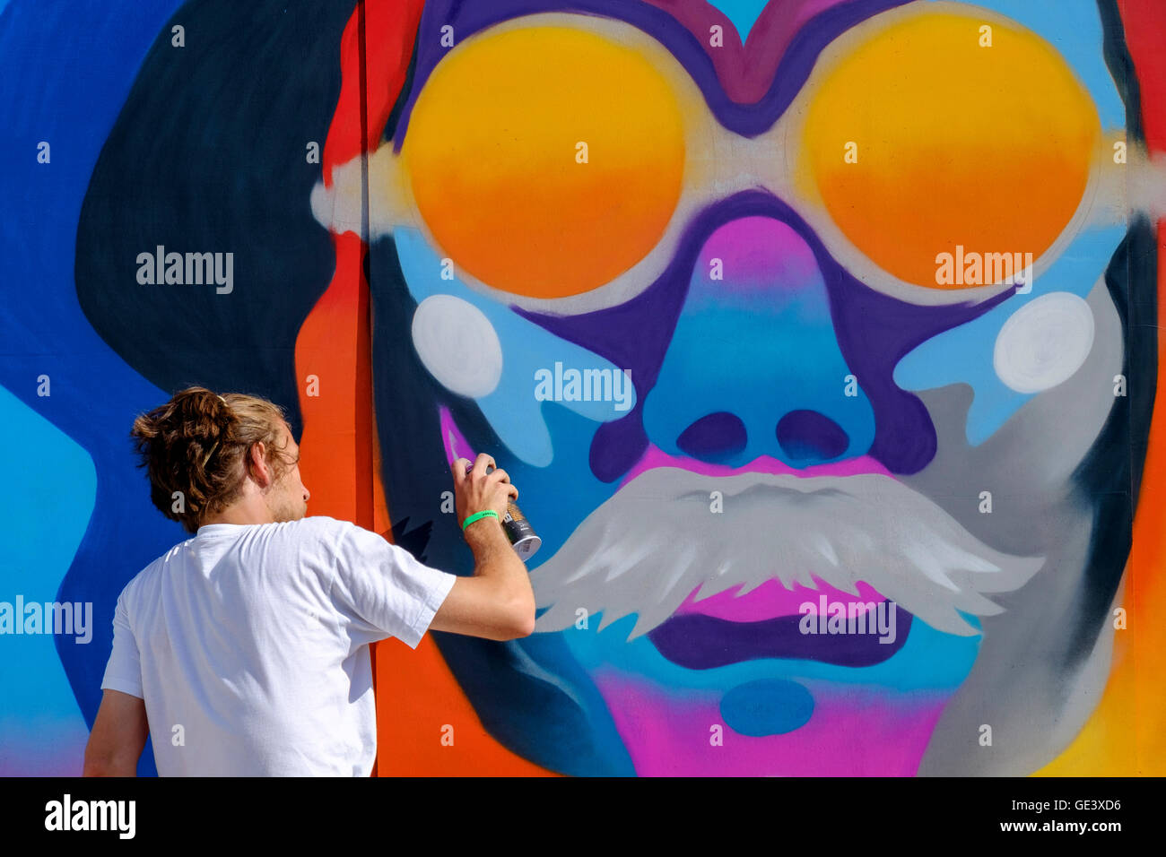 Bristol, UK, 23rd July, 2016. An artist is pictured in South Street ...