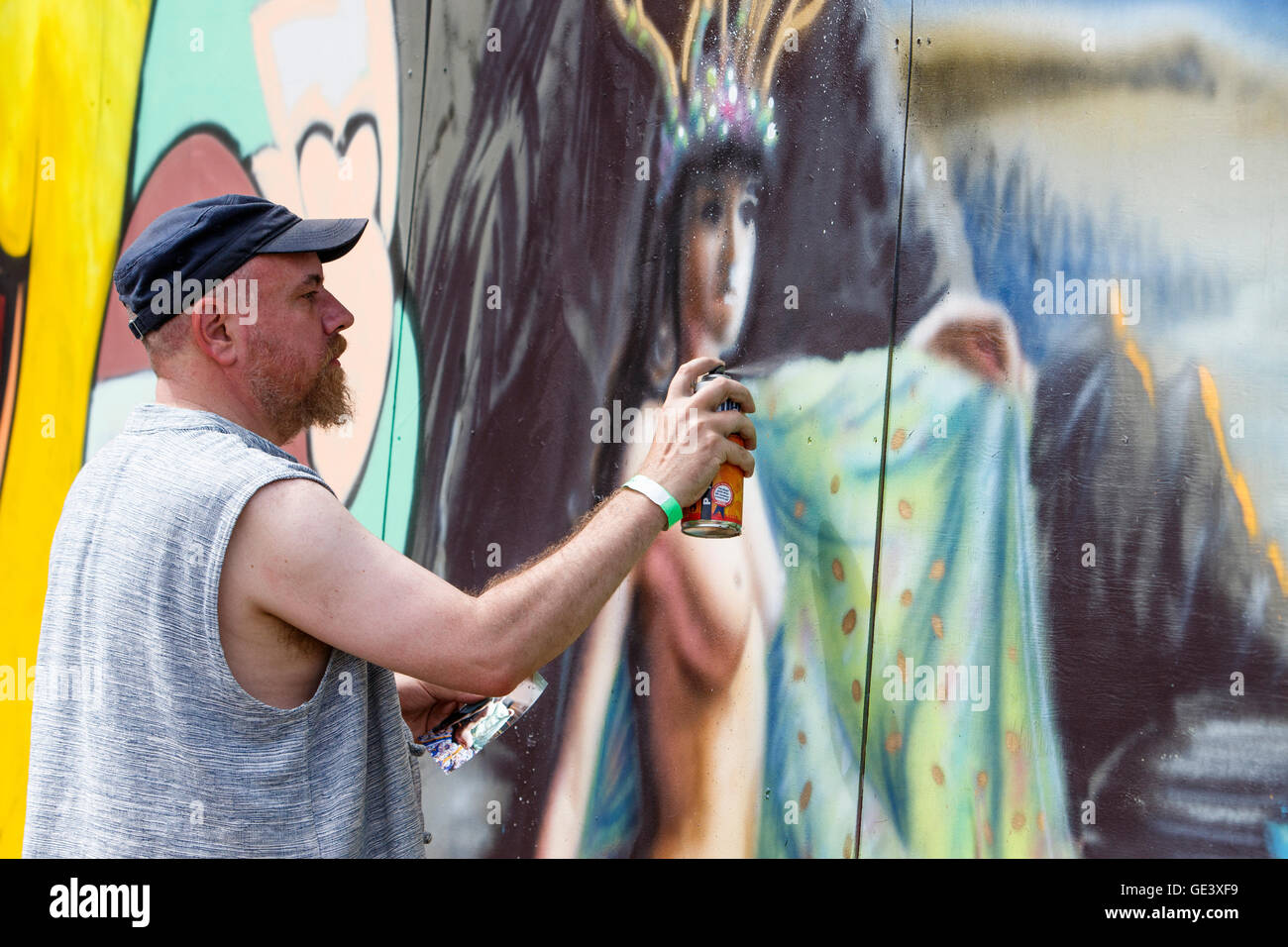 Bristol, UK, 23rd July, 2016. An artist is pictured in South Street ...