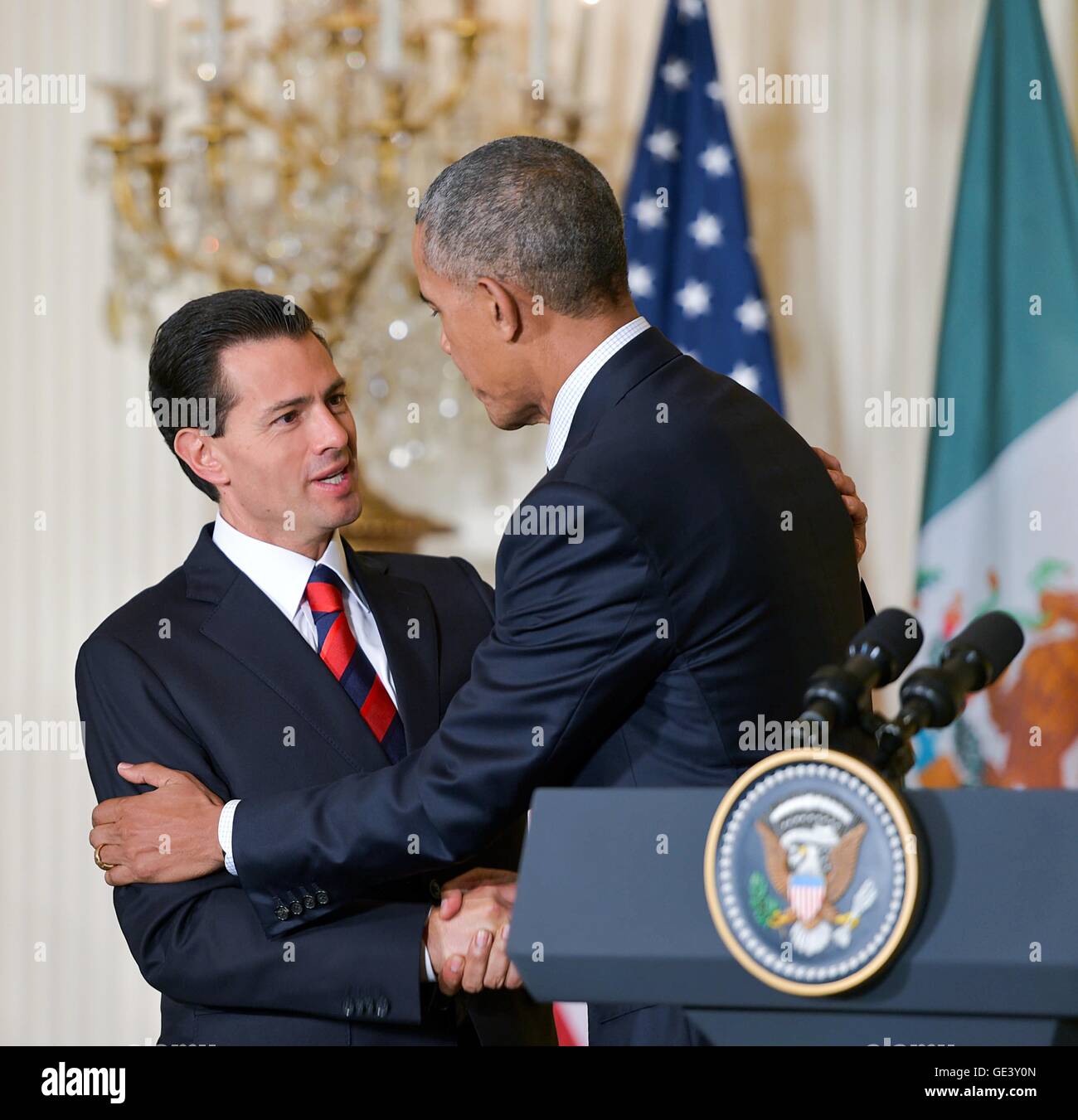 U.S President Barack Obama shakes hands with Mexican President Enrique ...