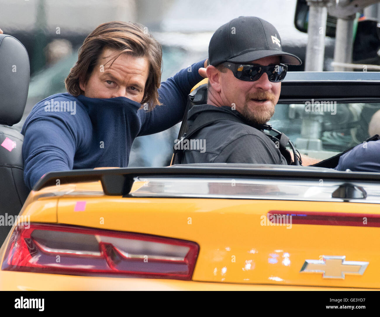 Detroit, MI, USA. 23rd July, 2016. Mark Wahlberg covers his face ...