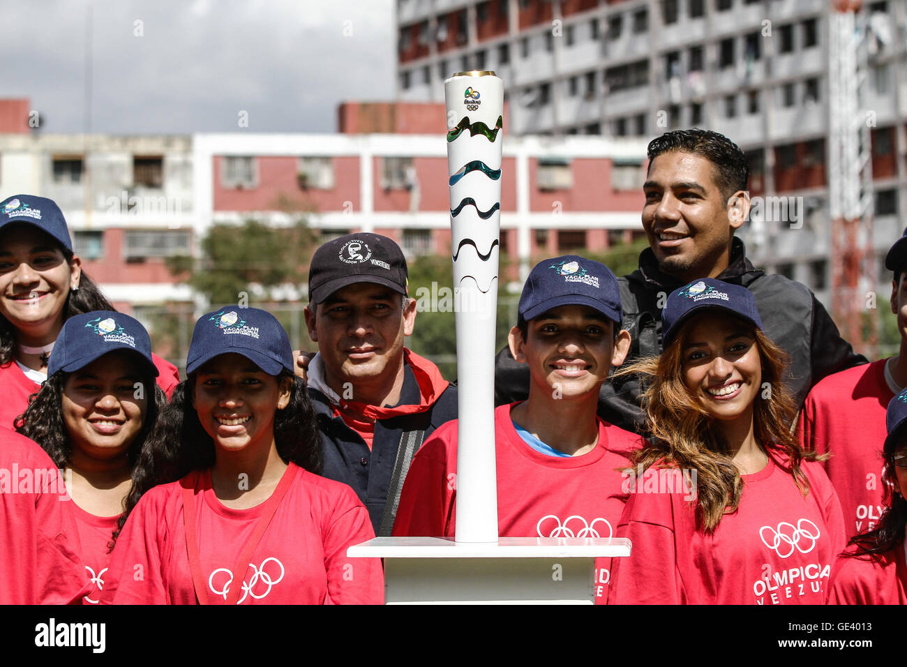 Caracas, Venezuela. 23rd July, 2016. Athletes pose with an official ...