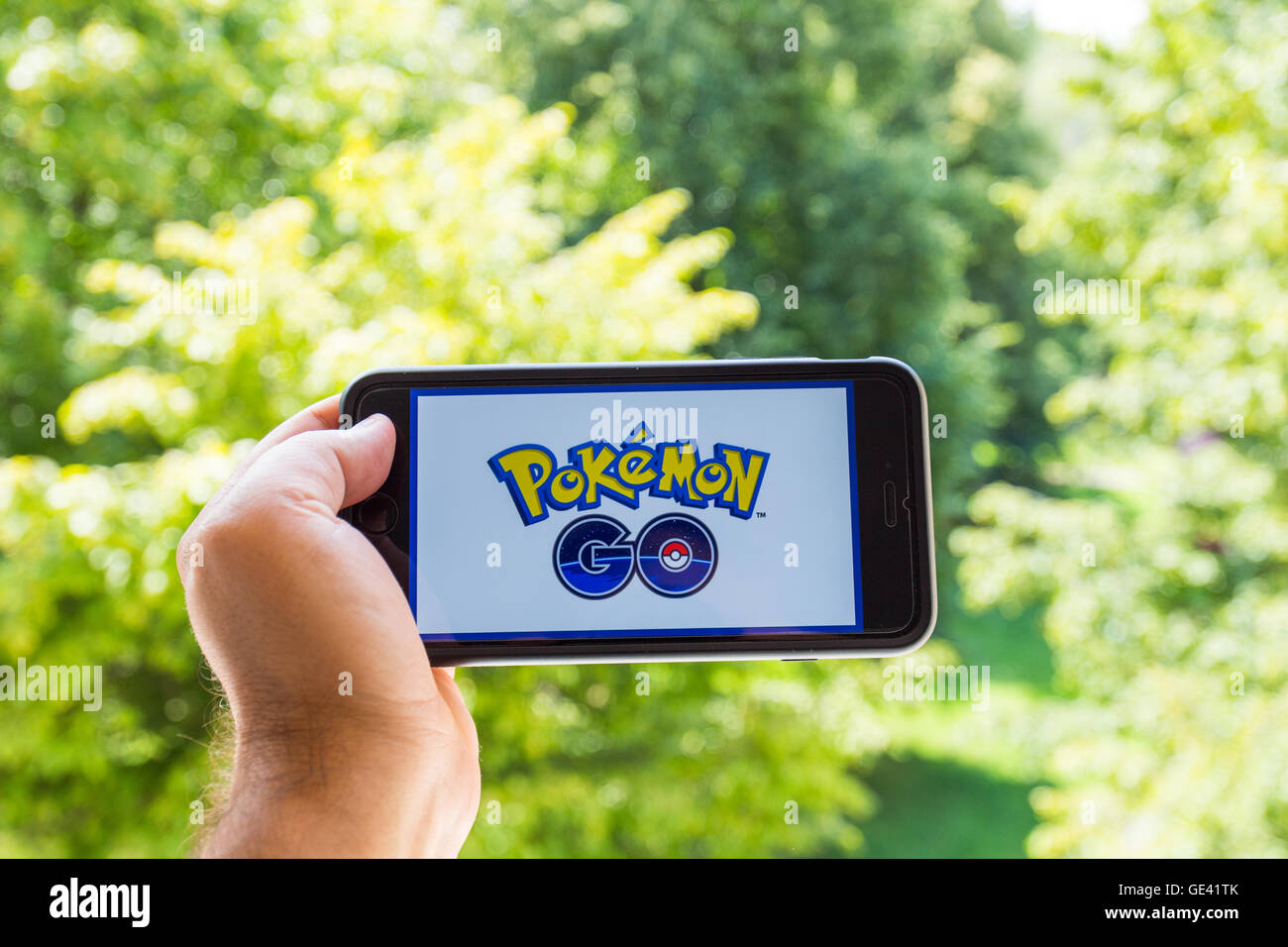 Apple iPhone6 Plus held in one hand showing its screen with Pokemon Go ...