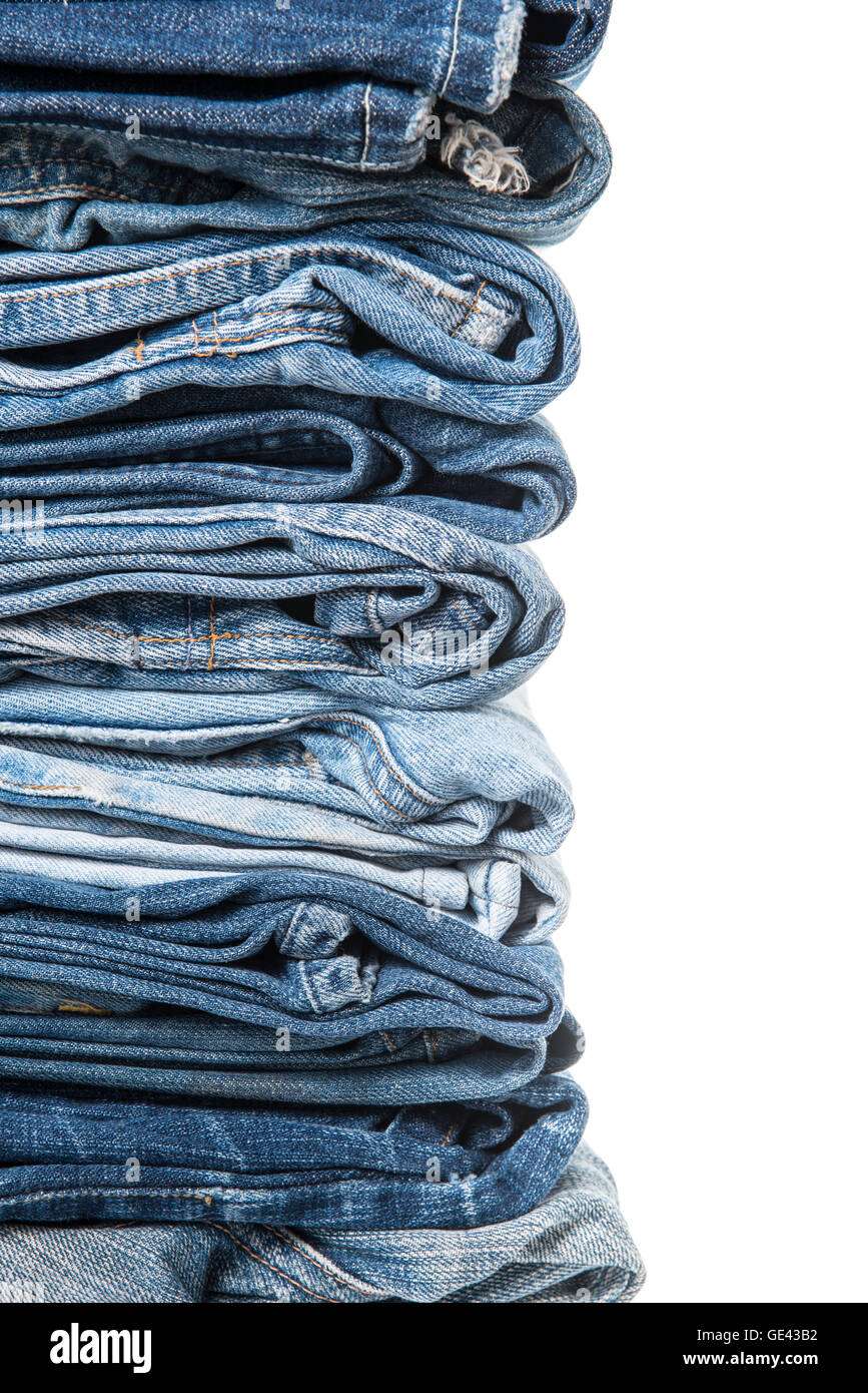 stack of jeans on white background Stock Photo - Alamy