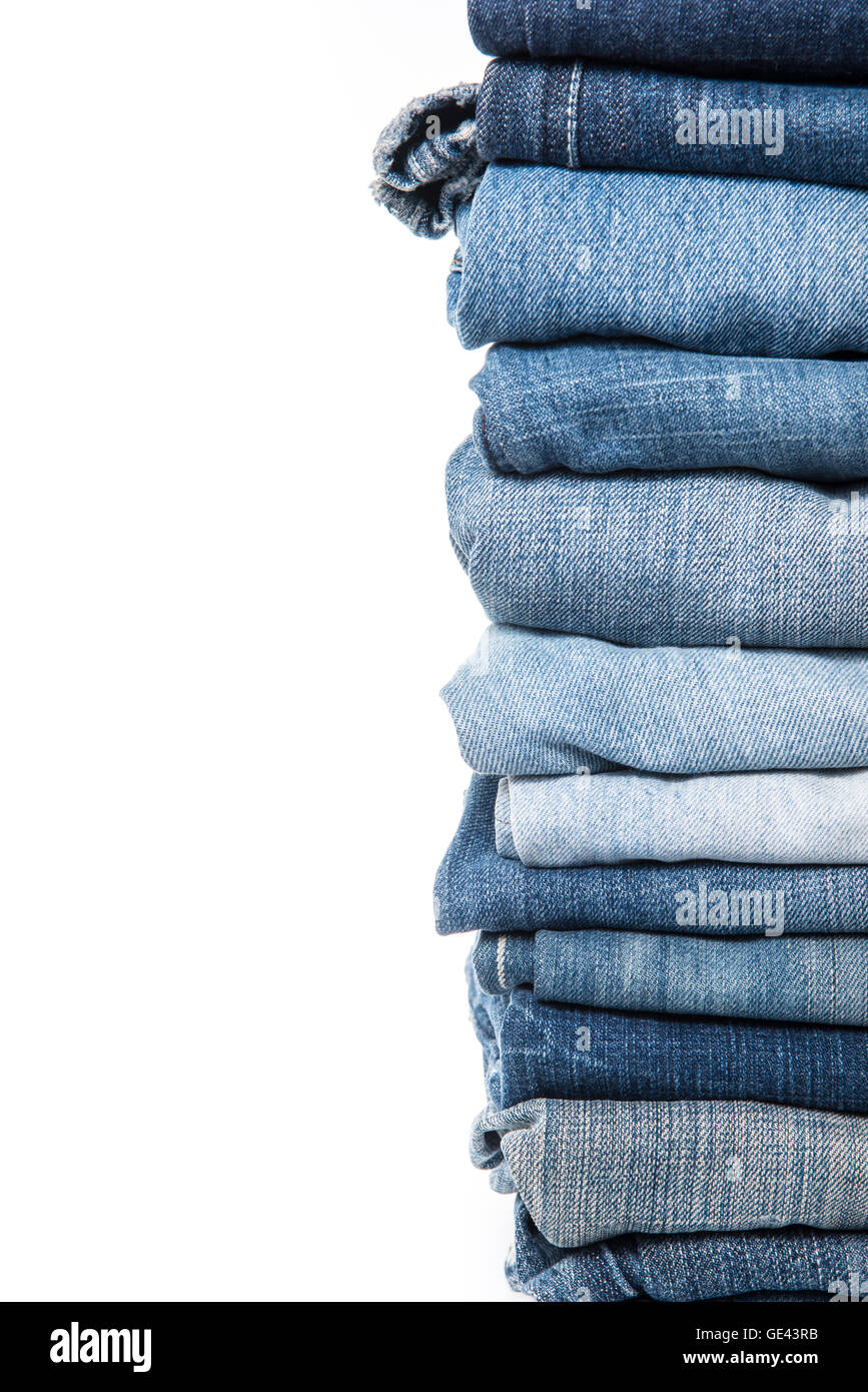 stack of jeans on white background Stock Photo - Alamy