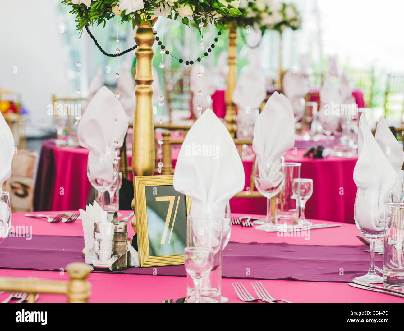 Wedding table with the sign number seven Stock Photo - Alamy