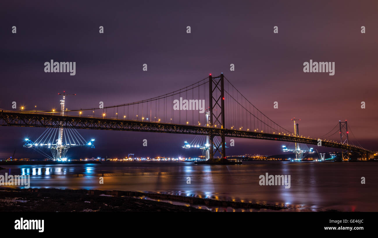 The old and new Forth Road bridges from Queensferry at night Stock ...