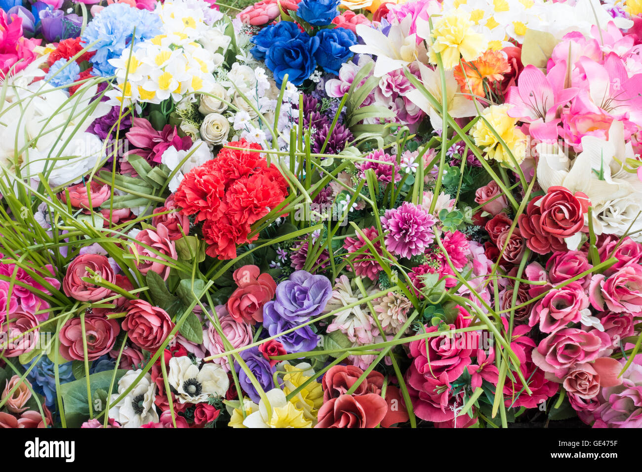 Arrangement of colorful Artificial Flowers Stock Photo - Alamy