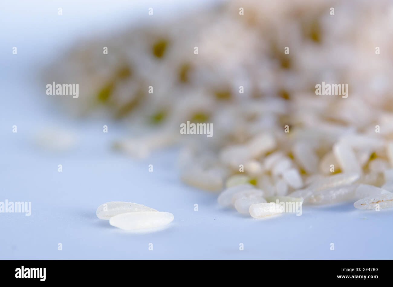 Heap of natural rice isolated on white background Stock Photo - Alamy