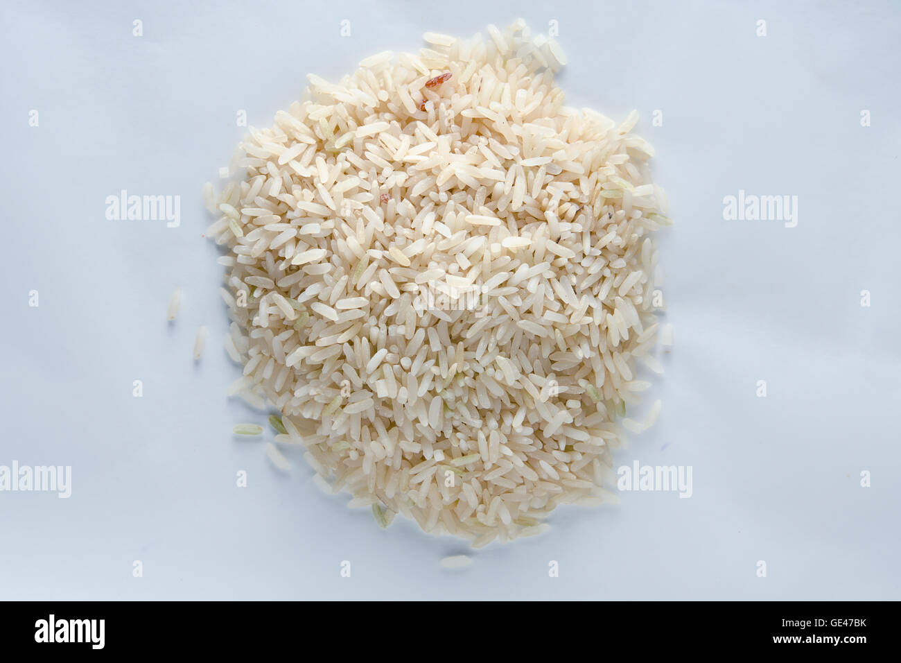 Heap of natural rice isolated on white background Stock Photo - Alamy