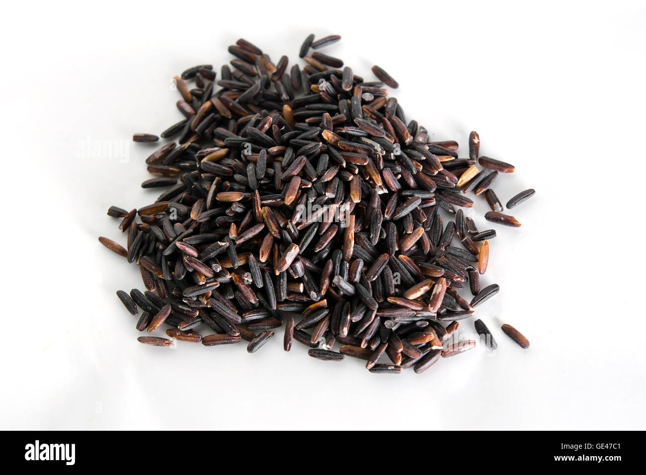 Piles of raw rice berry rice isolated on white background Stock Photo ...