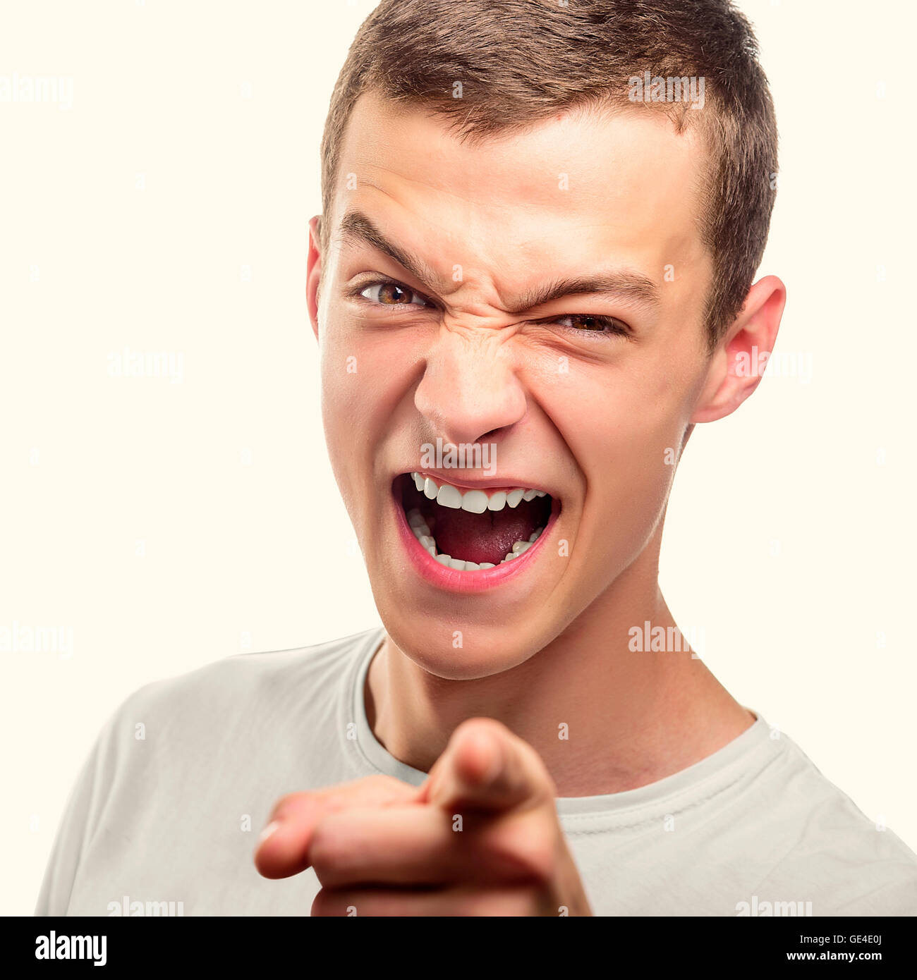 Portrait of young angry man points finger. Toned photo Stock Photo - Alamy