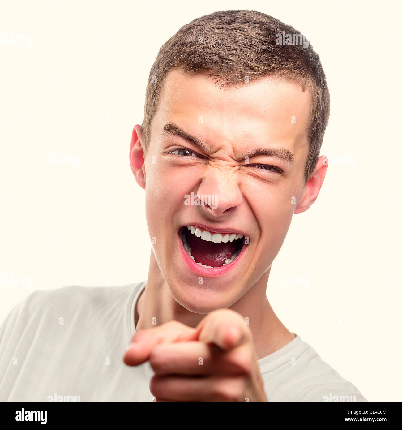 Portrait of young angry man points finger. Toned photo Stock Photo - Alamy