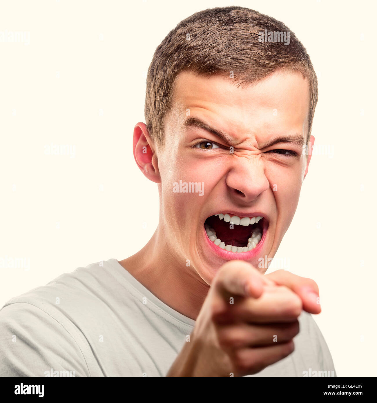 Portrait of young angry man points finger. Toned photo Stock Photo - Alamy