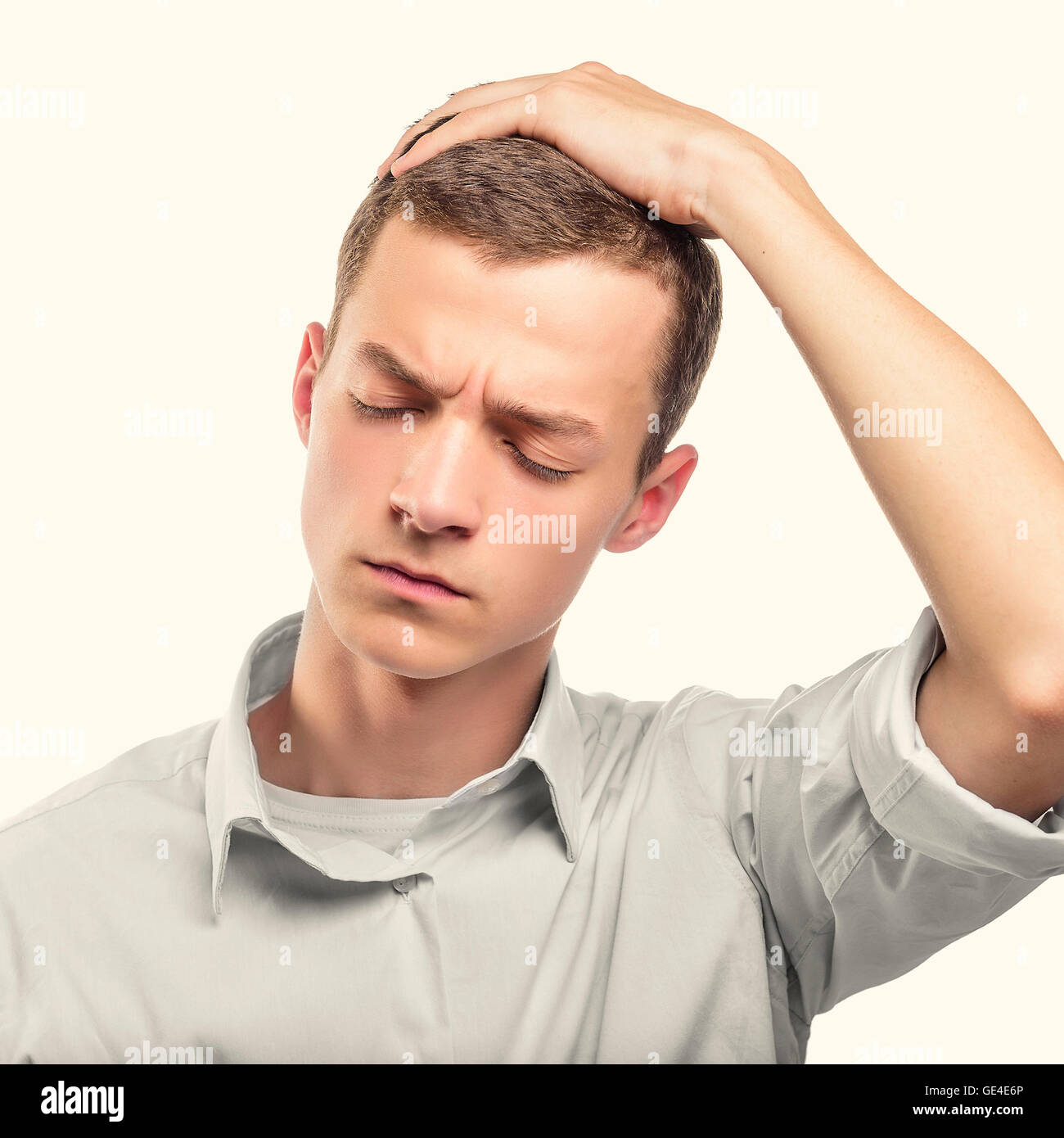White man has stress and worry and he is holding his hands on his head ...