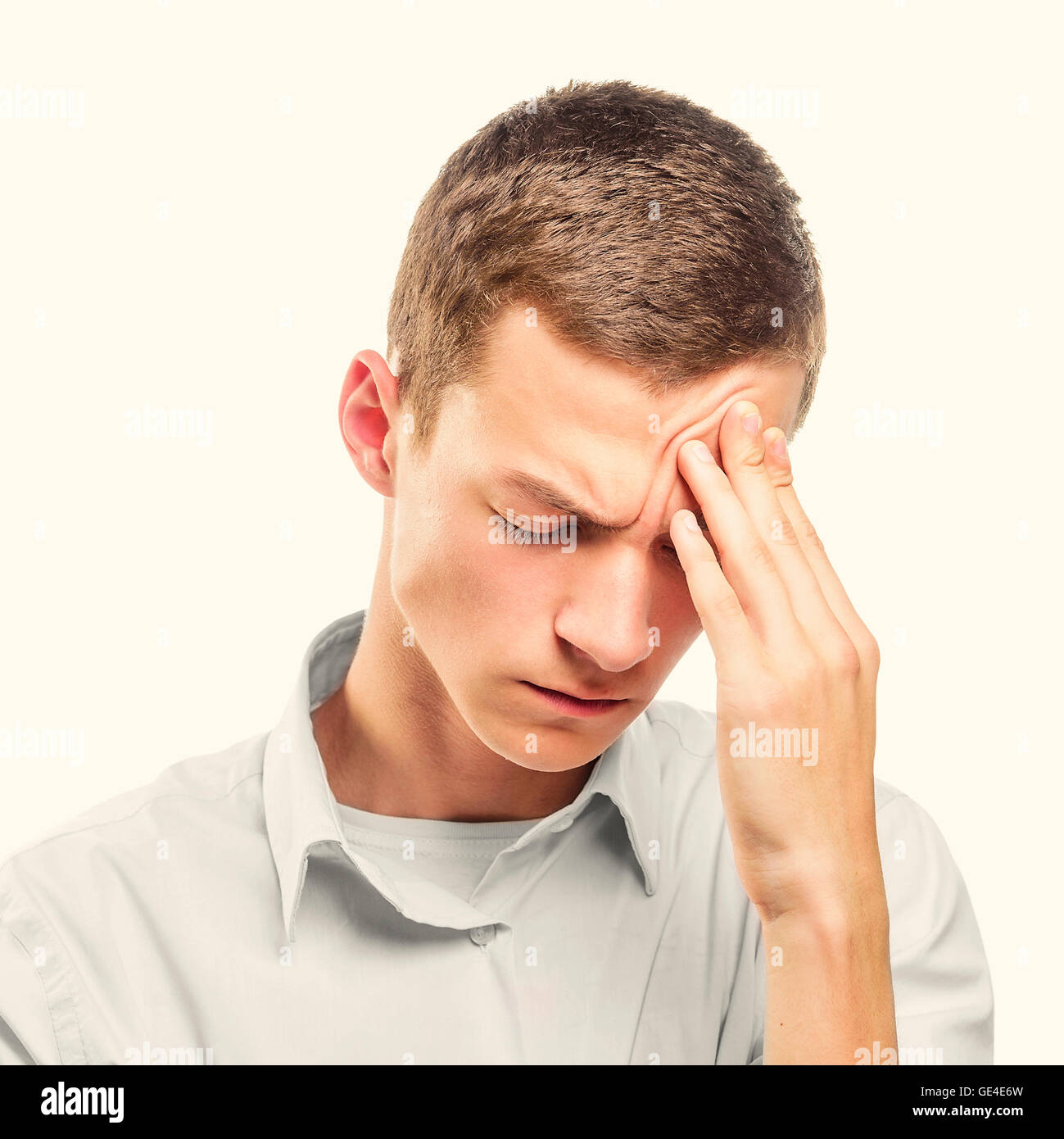 White man has stress and worry and he is holding his hands on his head ...