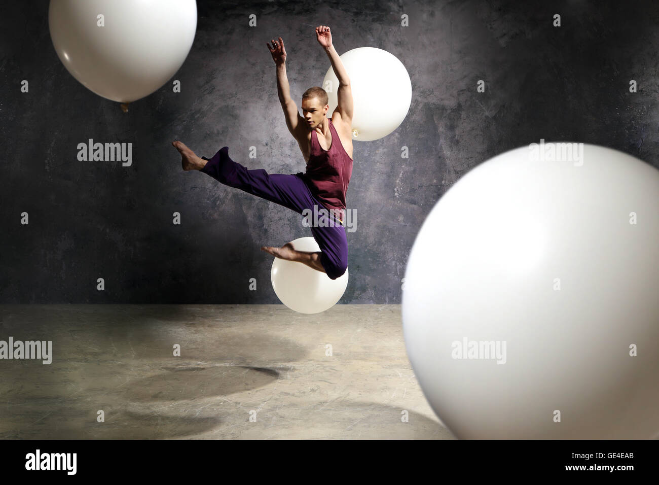 Dancer in the jump, young dancer is jumping on stage Stock Photo - Alamy