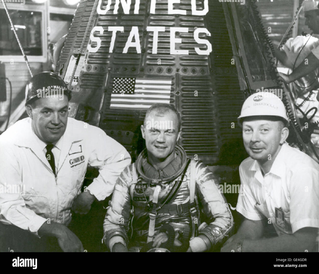 Astronaut John Glenn stands beside the Friendship 7 spacecraft during a ...