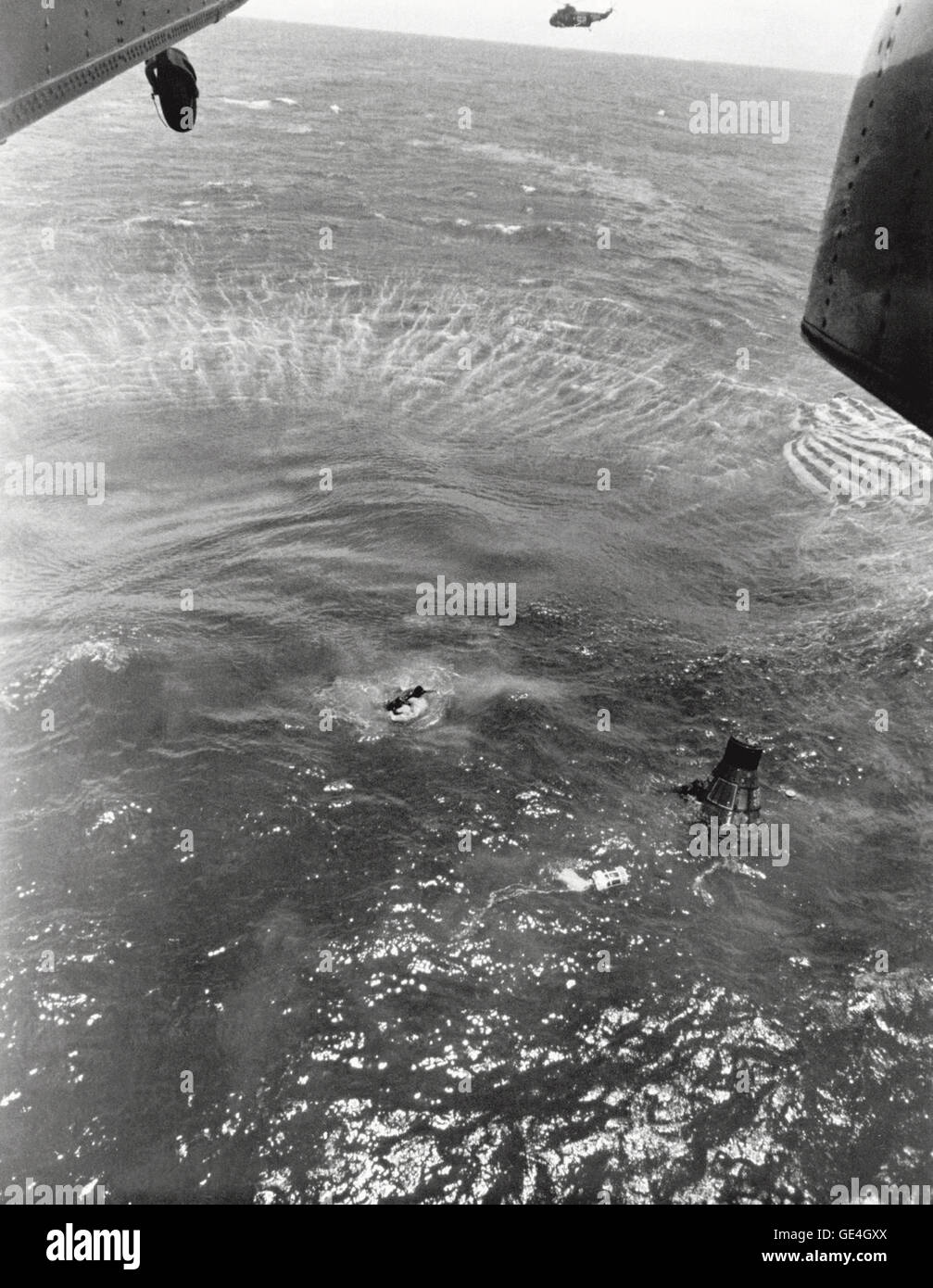 A U.S. Navy frogman makes contact with astronaut Gordon Cooper during ...