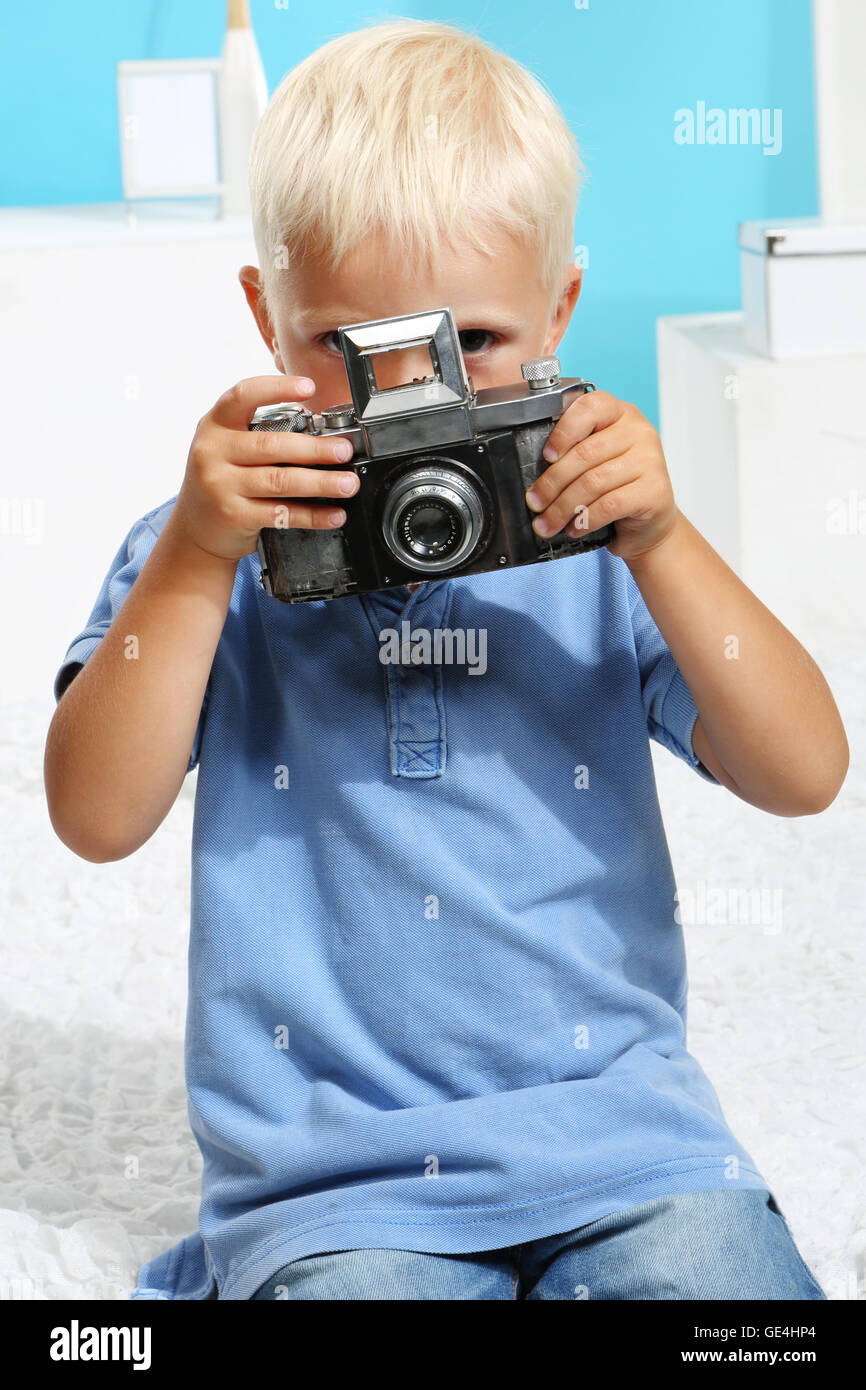 Boy with a camera Stock Photo - Alamy