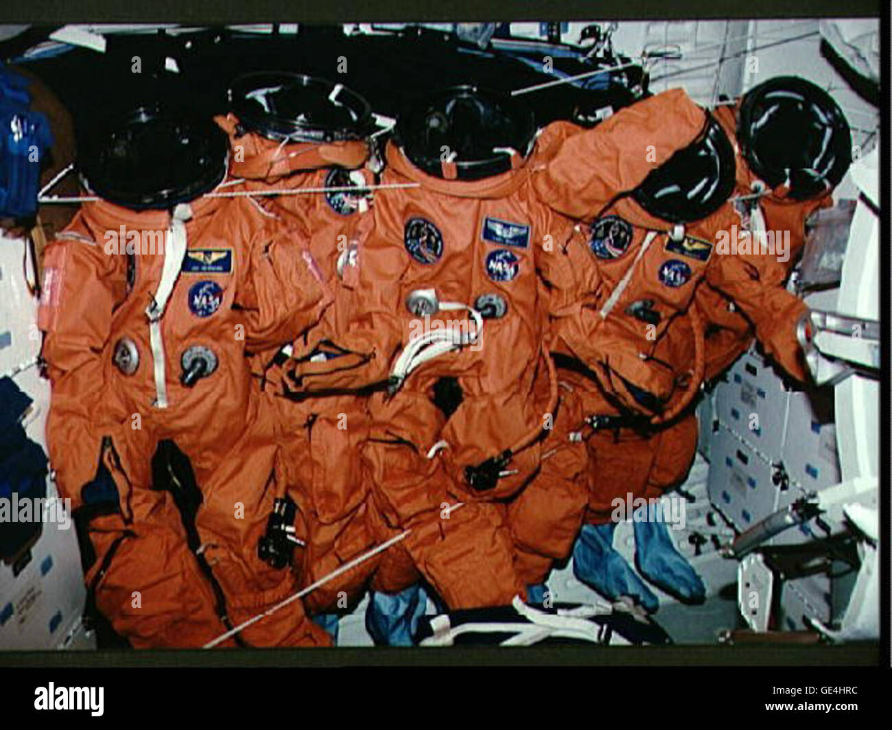 The image depicts the STS-51 mission’s entry garments, arranged on the ...
