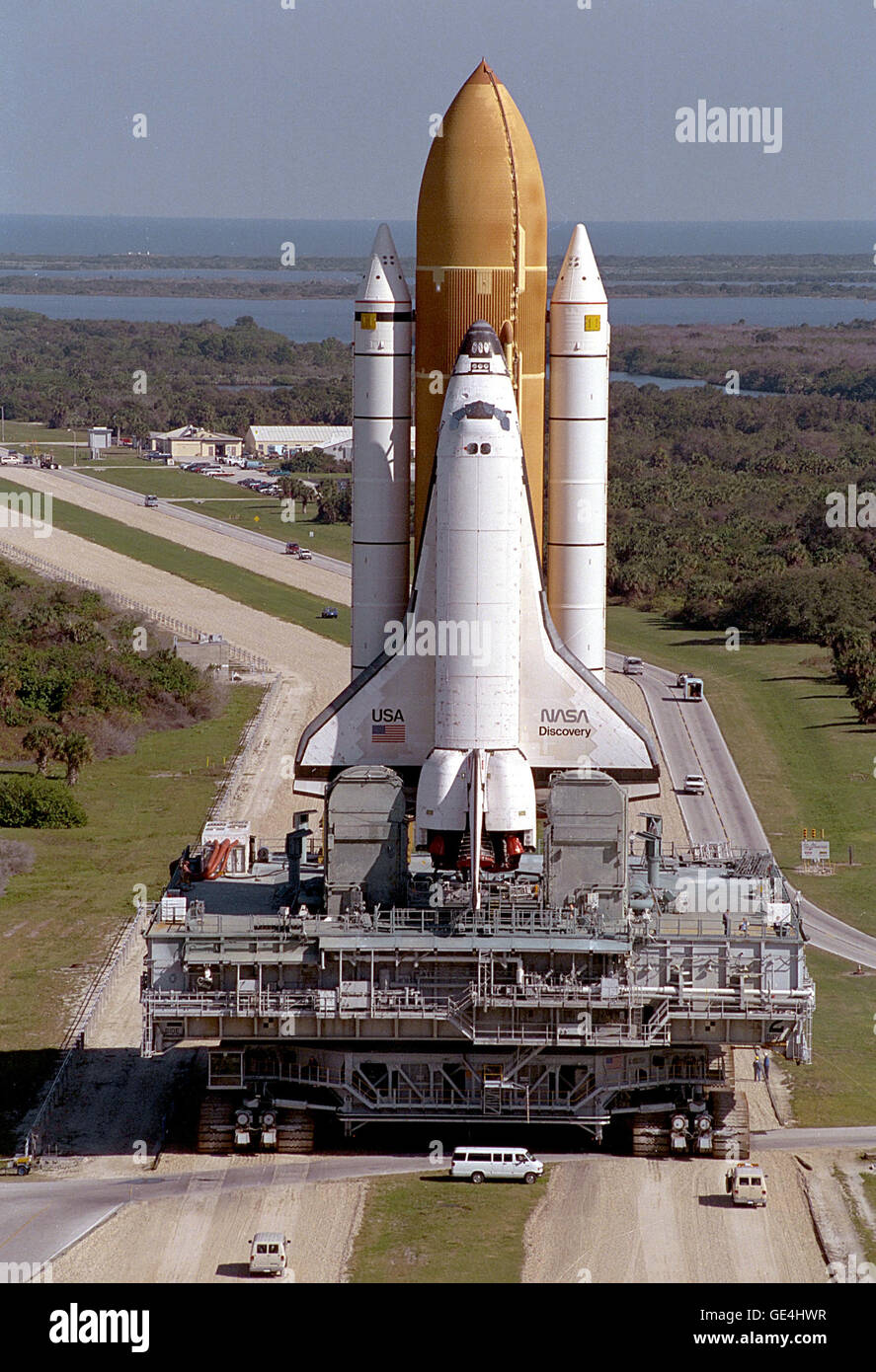 The Space Shuttle *Discovery* makes its final move towards the launch ...