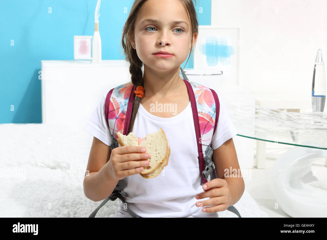 School girl eating a sandwich Stock Photo - Alamy