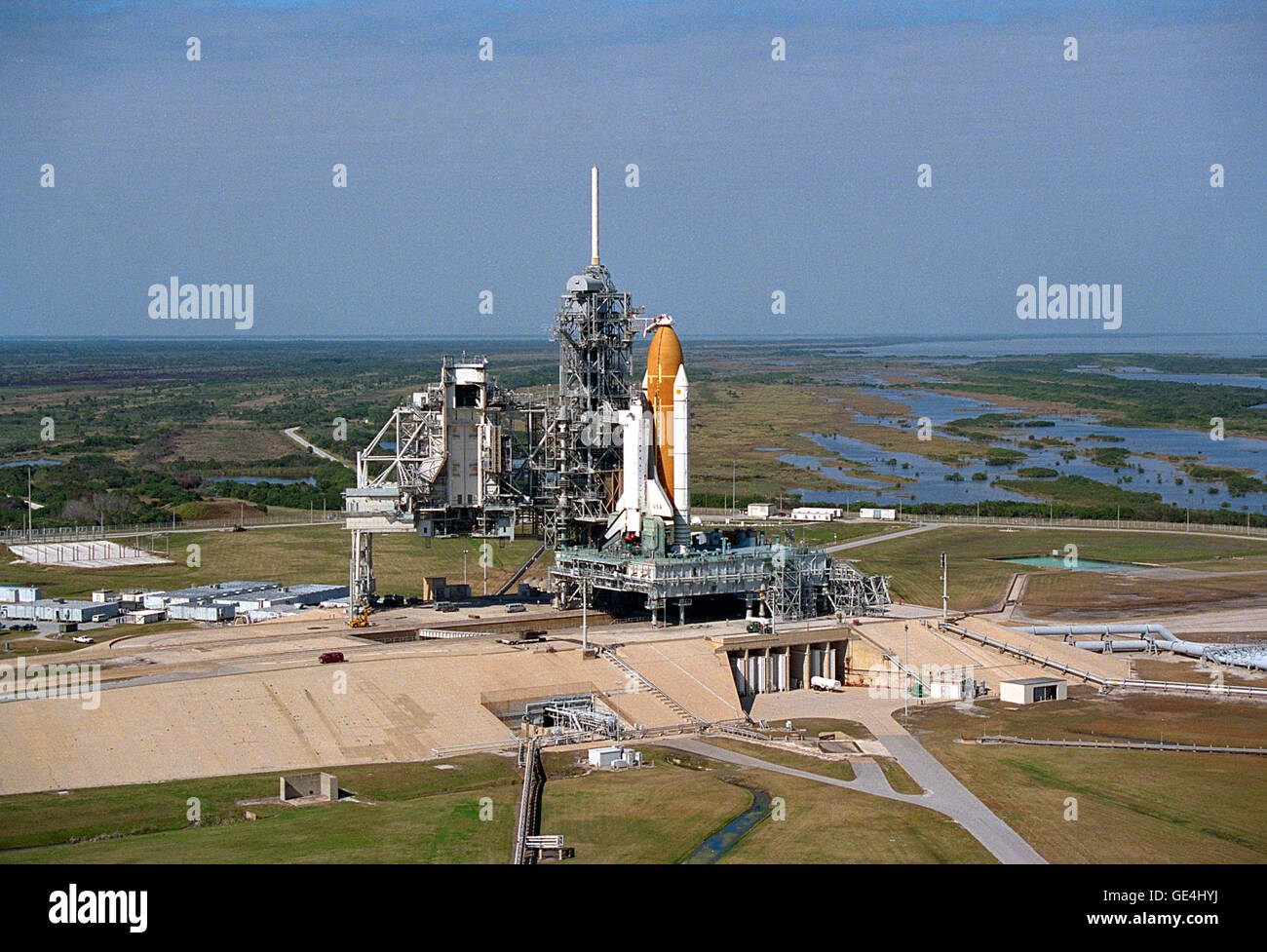This aerial view captures the Space Shuttle Columbia at Launch Pad 39B ...
