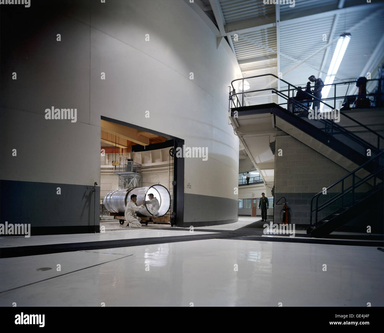 This image shows technicians working inside a thimble-shaped structure ...