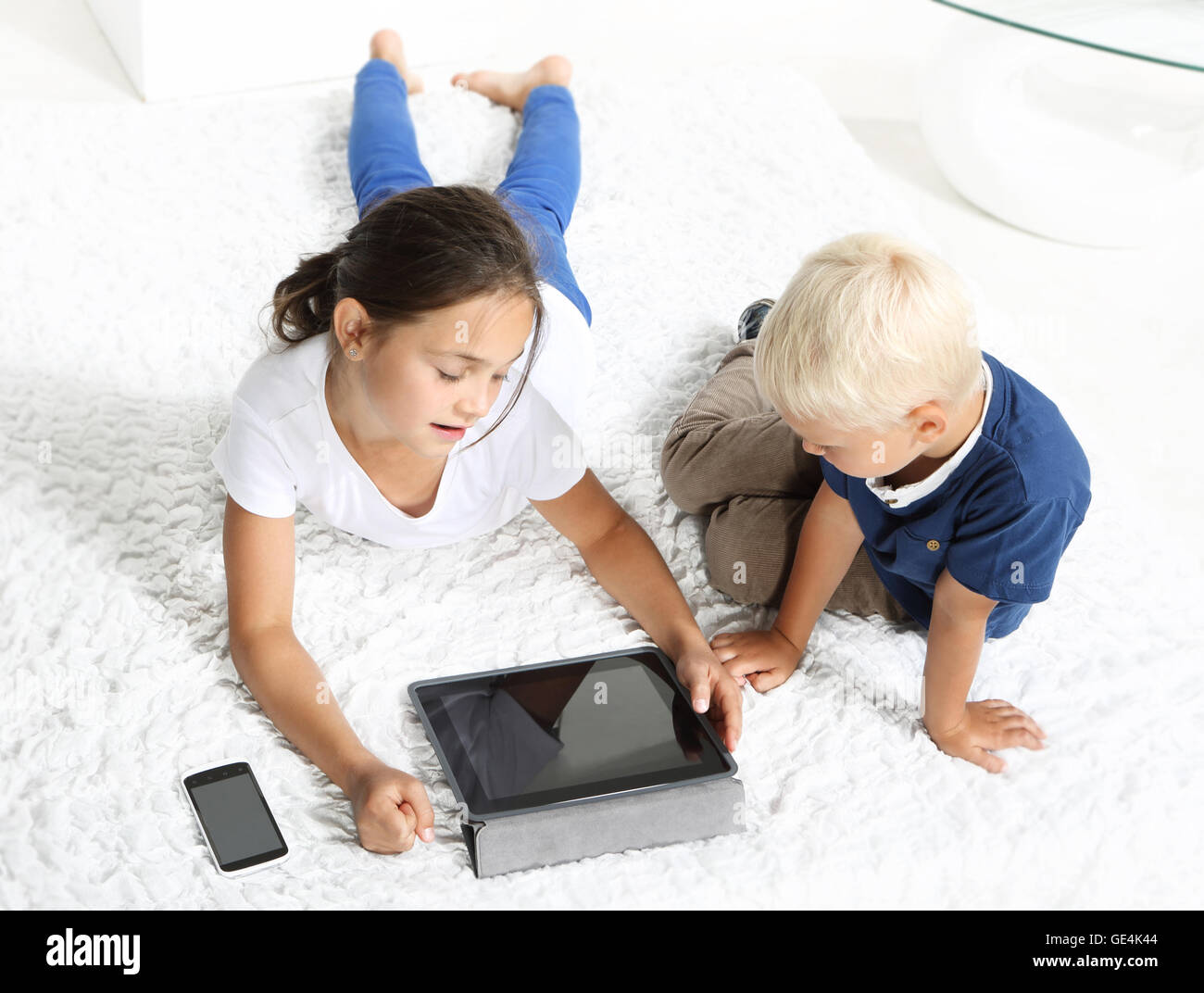 Children look tablet Stock Photo - Alamy