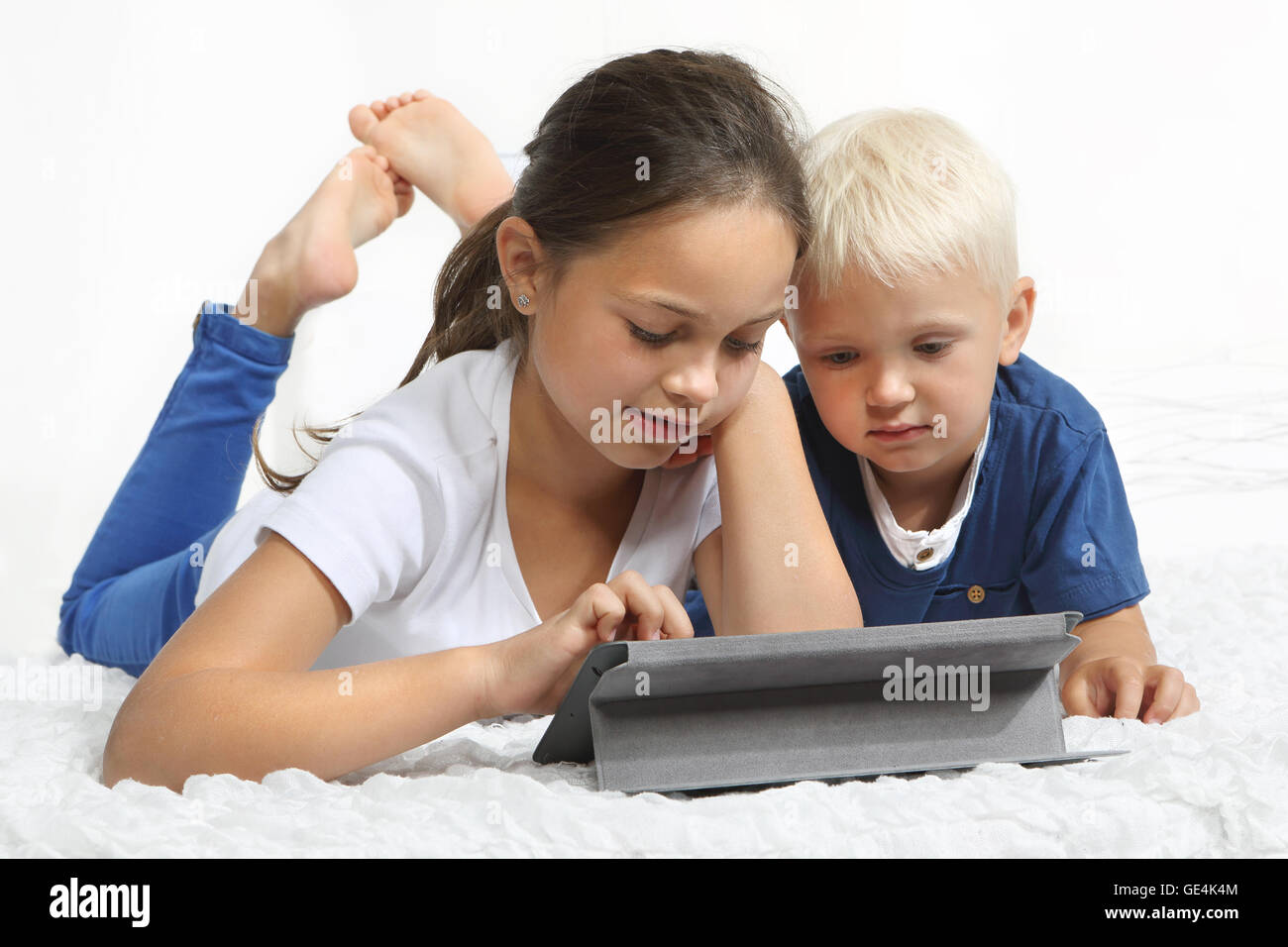 Children look tablet Stock Photo - Alamy