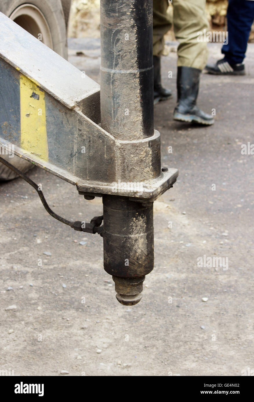 Truck strong outrigger stabilizing legs extended. Working foot ...