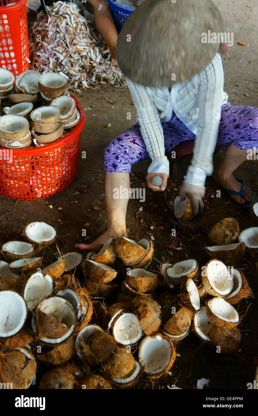 BEN TRE, VIET NAM, Asian worker working at coconut workshop with ...