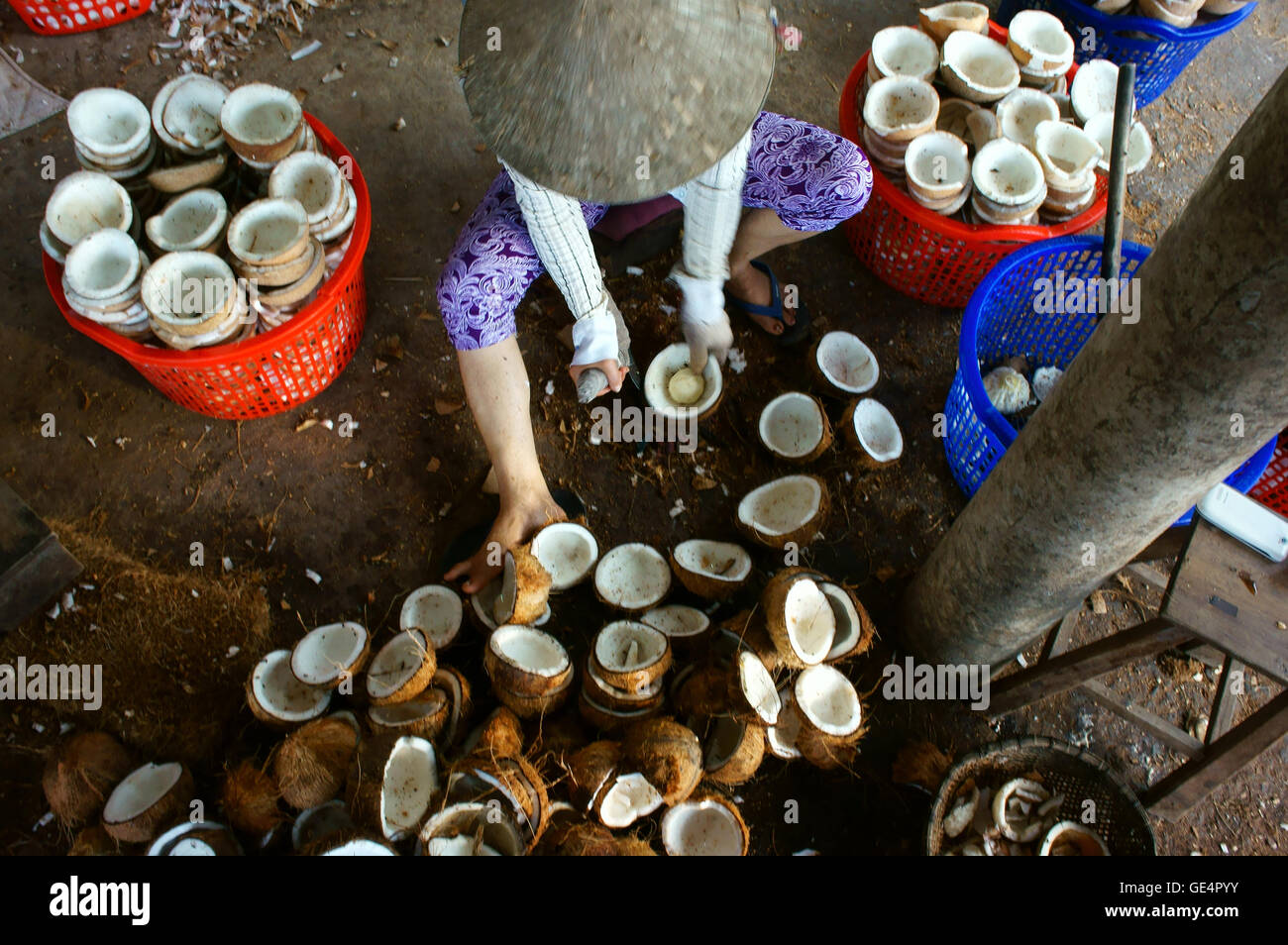 BEN TRE, VIET NAM, Asian worker working at coconut workshop with ...