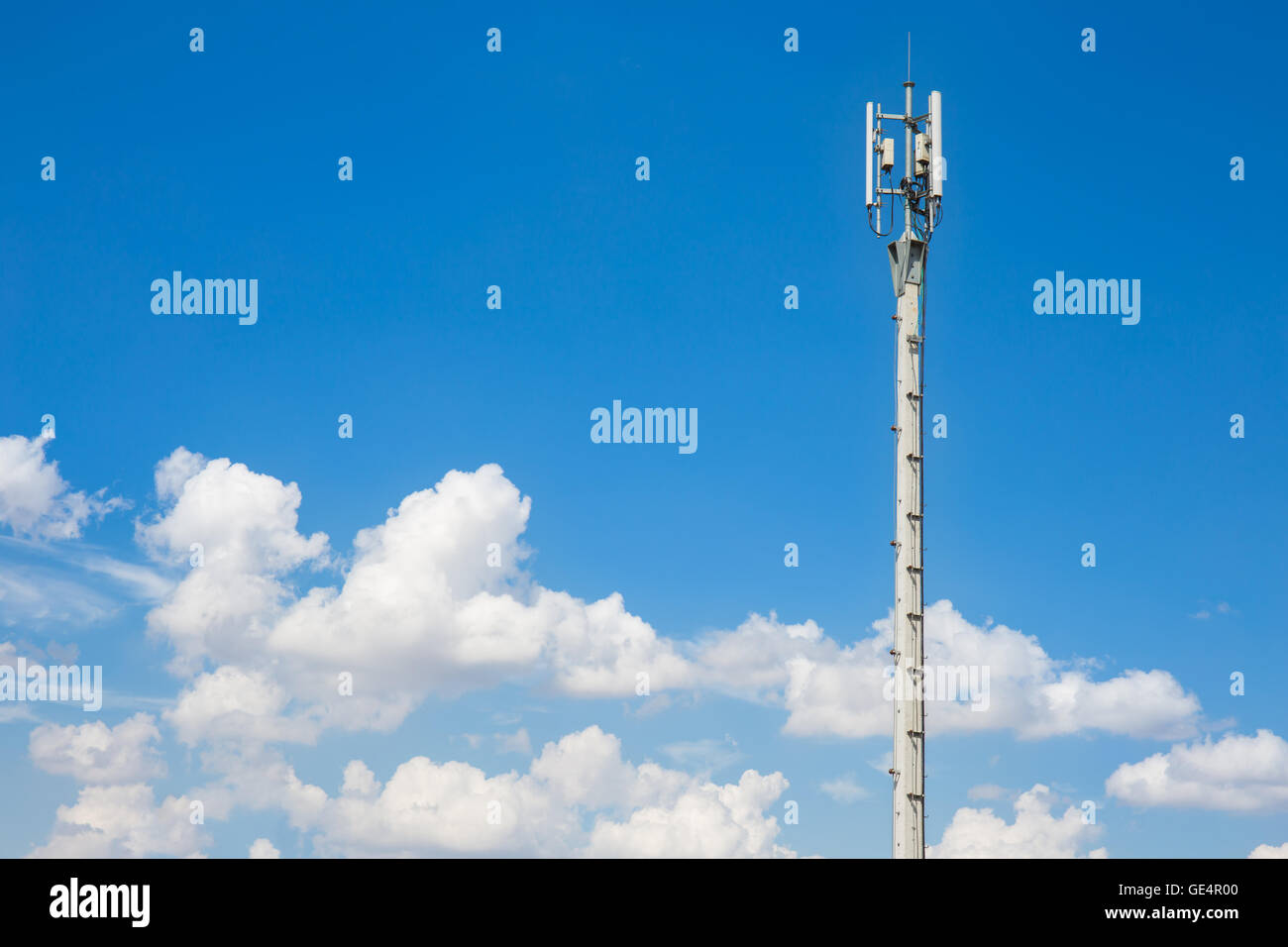 Communication antenna repeater tower on blue sky background Stock Photo ...