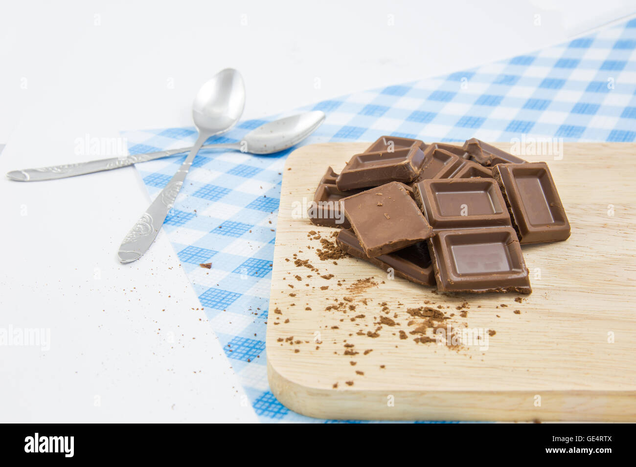 Group of chocolate candy isolated on wood. concept Stock Photo - Alamy
