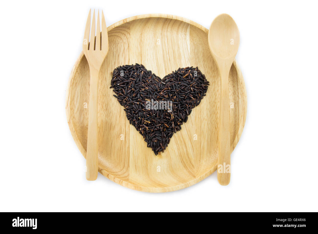 Heart rice berry in wooden bowls with spoon and forkon white background ...