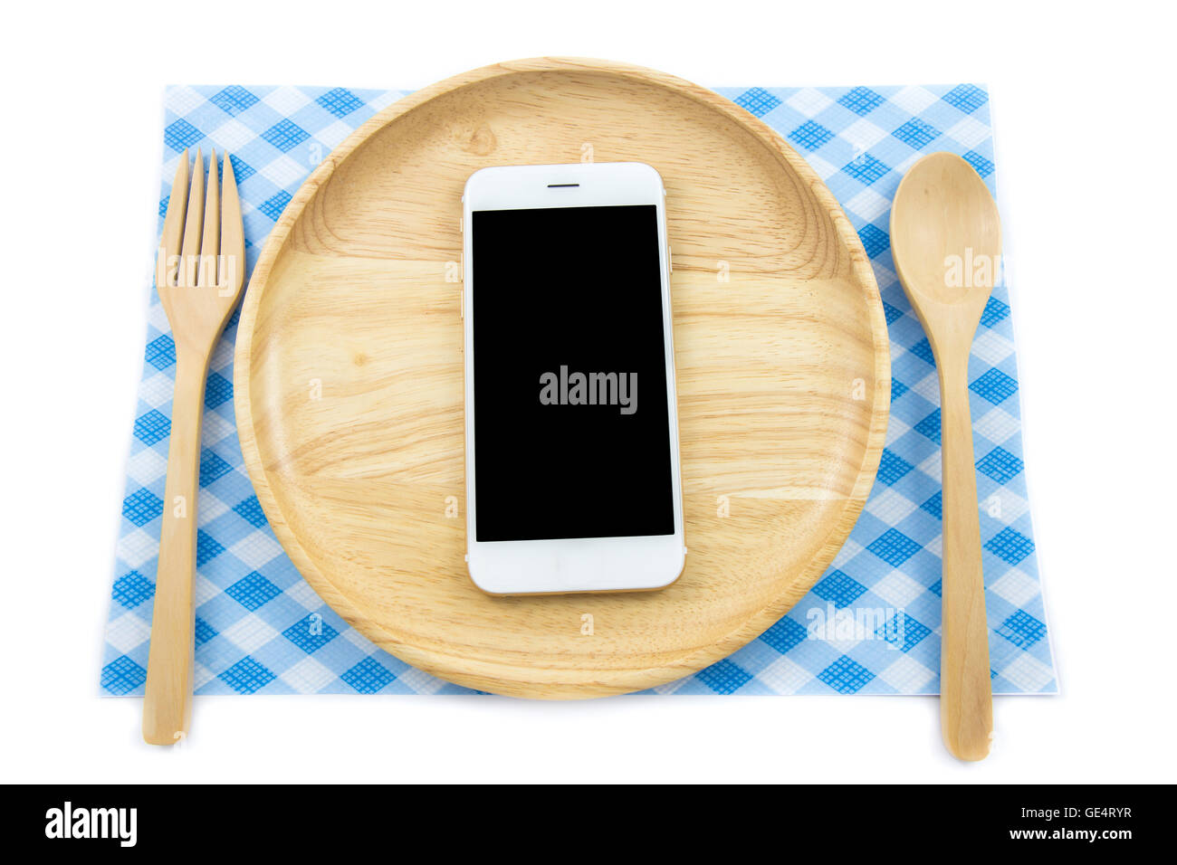 Top view smartphone on wooden dish with spon and fork on white ...