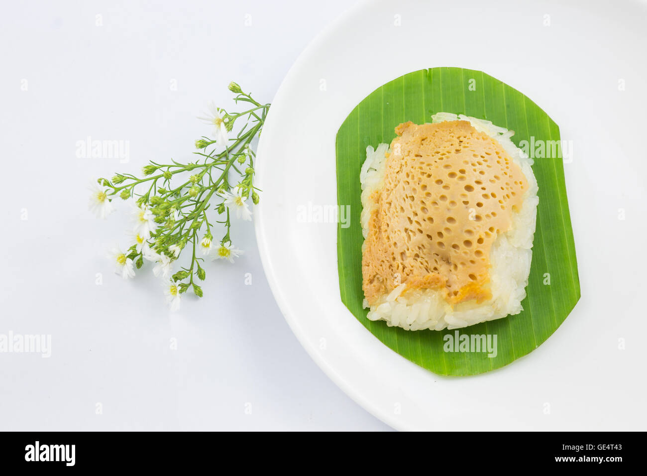 sticky rice with steamed custard on banana leaves and dish with flower ...