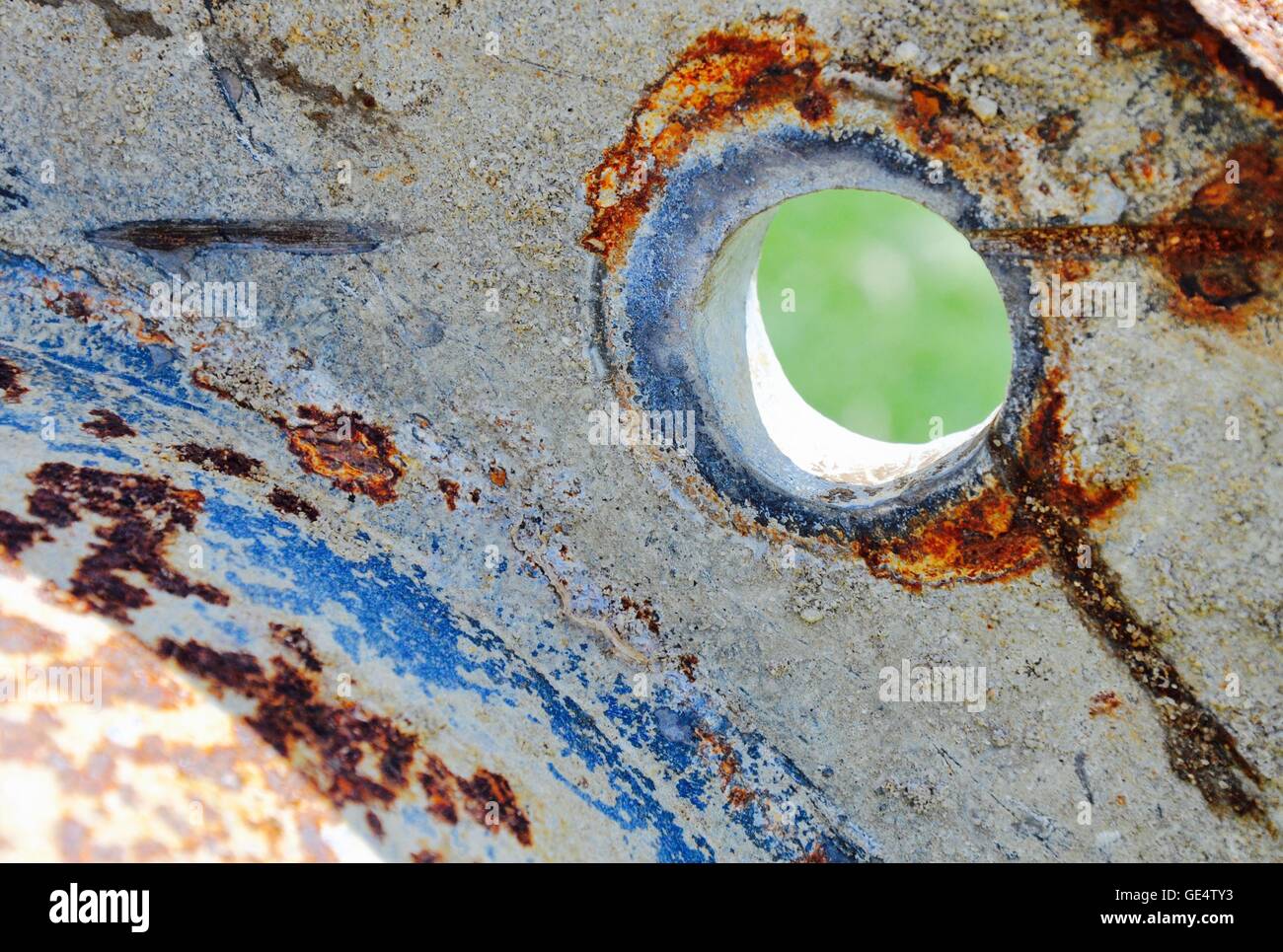 Abstract of large industrial and rusted metal pipe flange with bored ...
